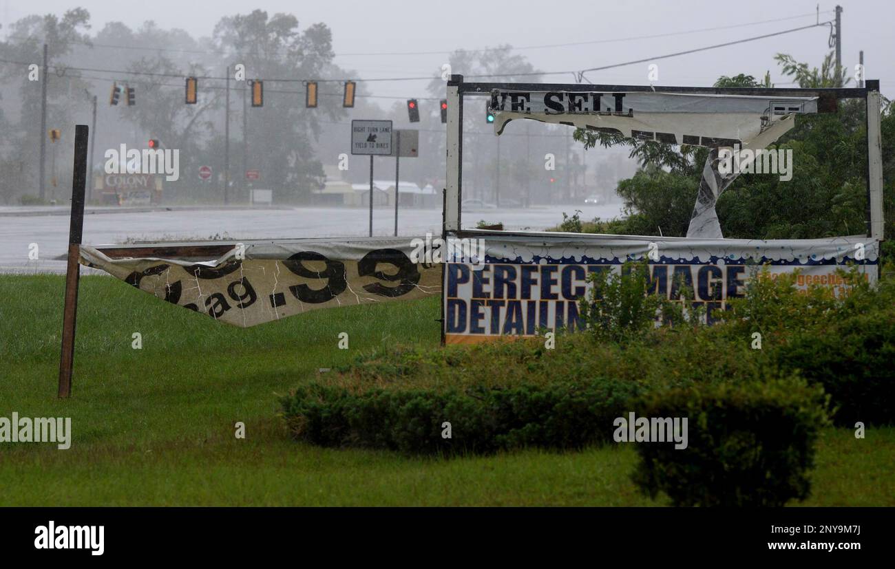Signs are torn up at a business on U.S. 17 in Savannah on Monday, Sept ...