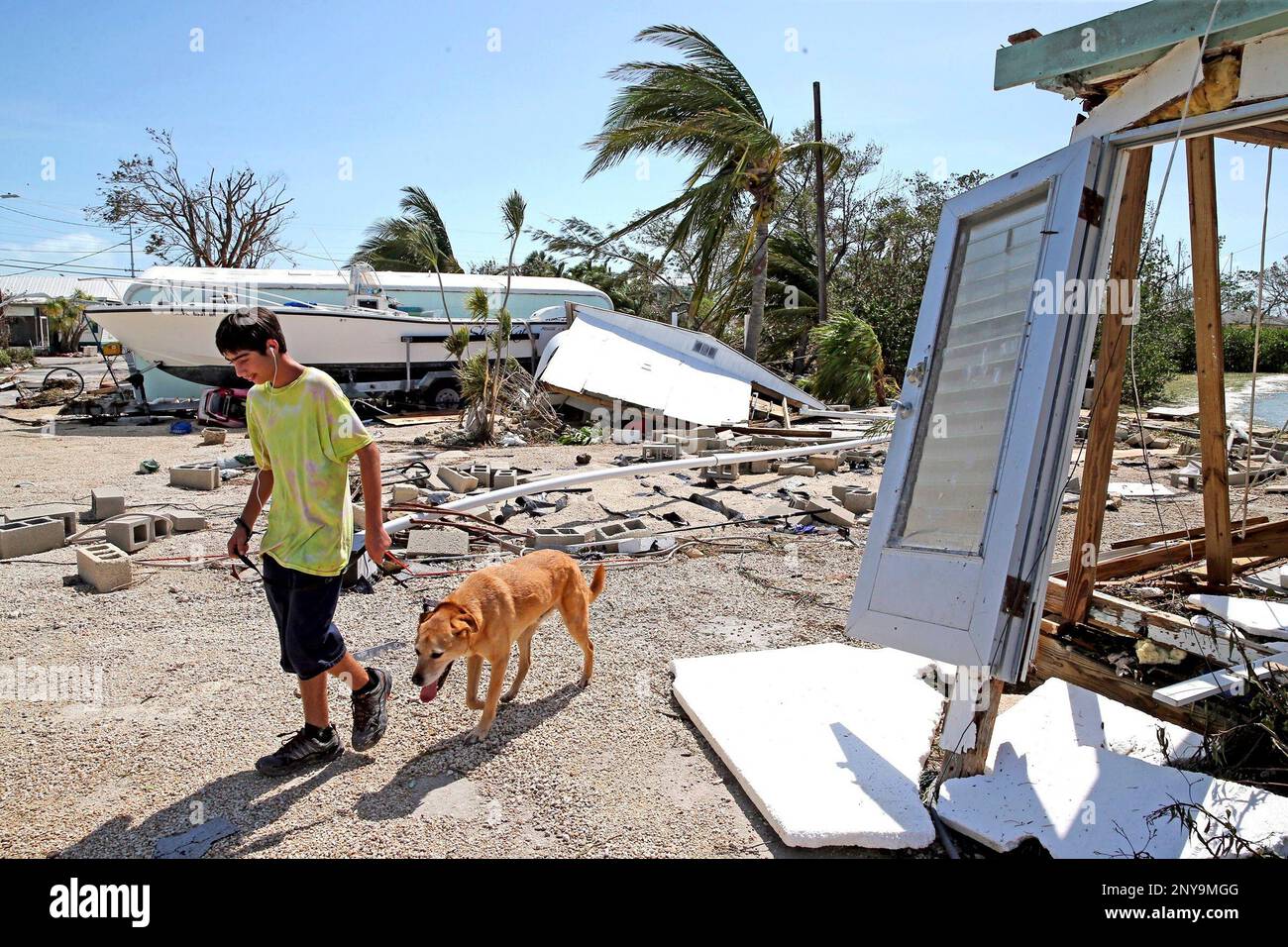 Bruce Gee 11, walks his dog Sarge, through the trailer park on Marathon ...