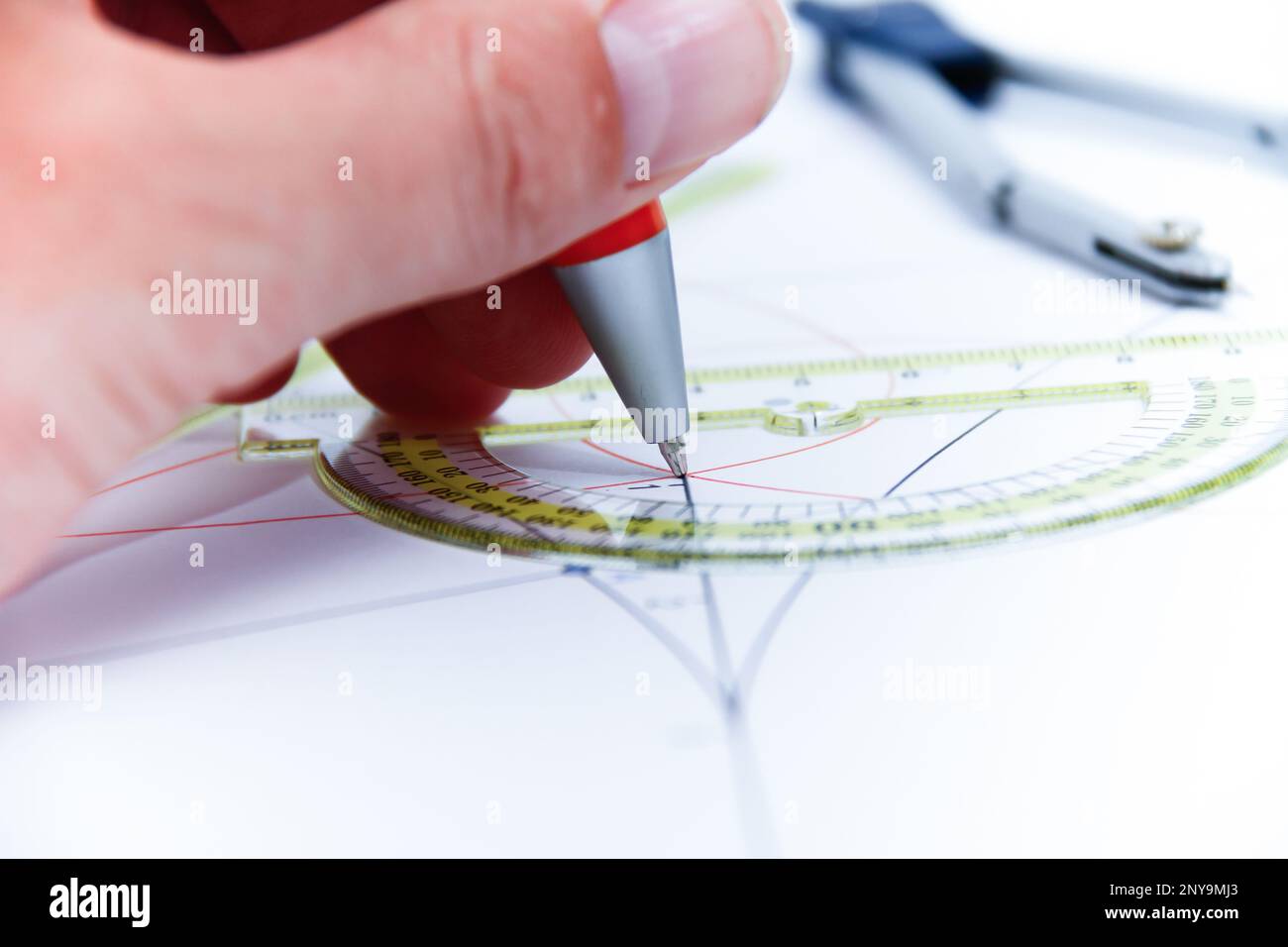 Professional architect working at his desk, measuring and estimating ...