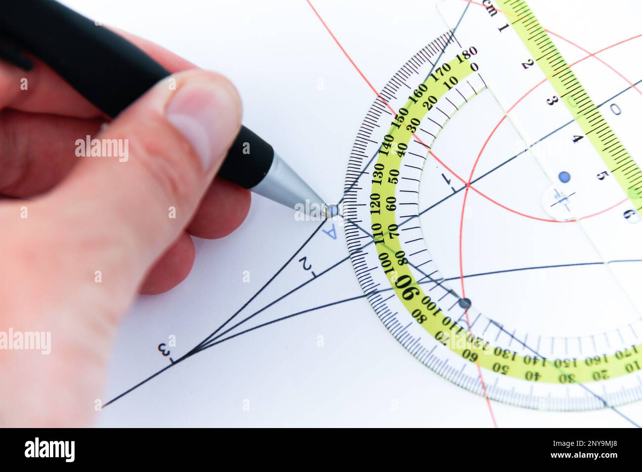 Professional architect working at his desk, measuring and estimating ...