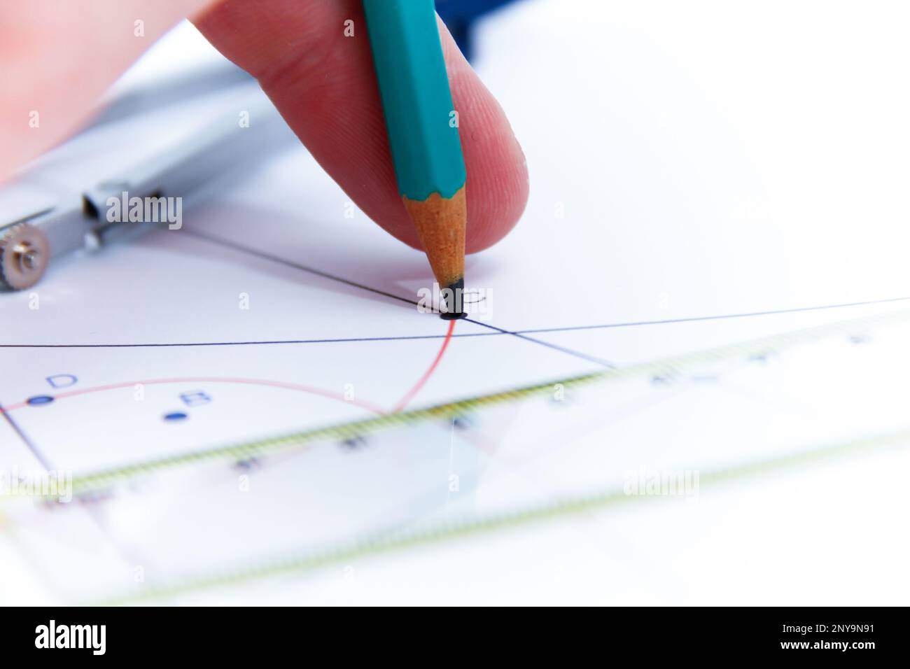 Professional architect working at his desk, measuring and estimating ...