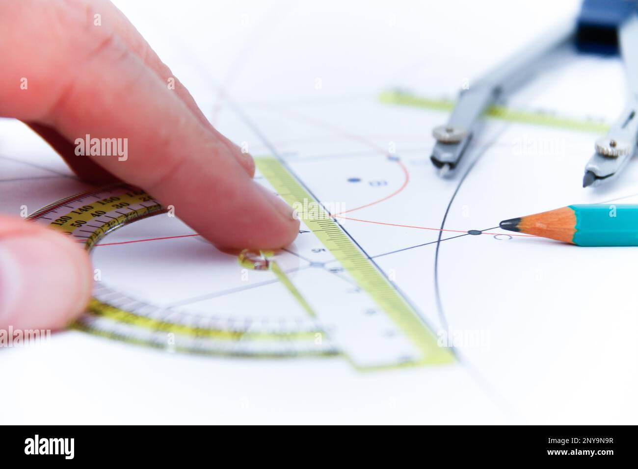 Professional architect working at his desk, measuring and estimating ...