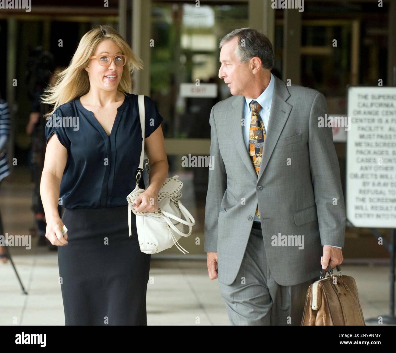 FILE--In this July 16, 2012, file photo, Jill Easter, 39, left, leaves the Santa Ana courthouse ...
