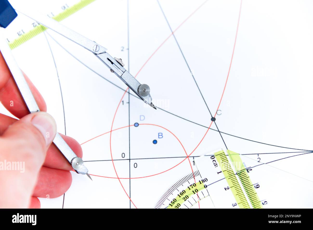 Professional architect working at his desk, measuring and estimating ...