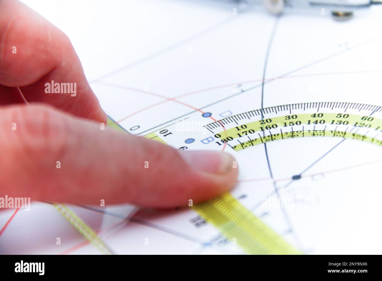 Professional architect working at his desk, measuring and estimating ...