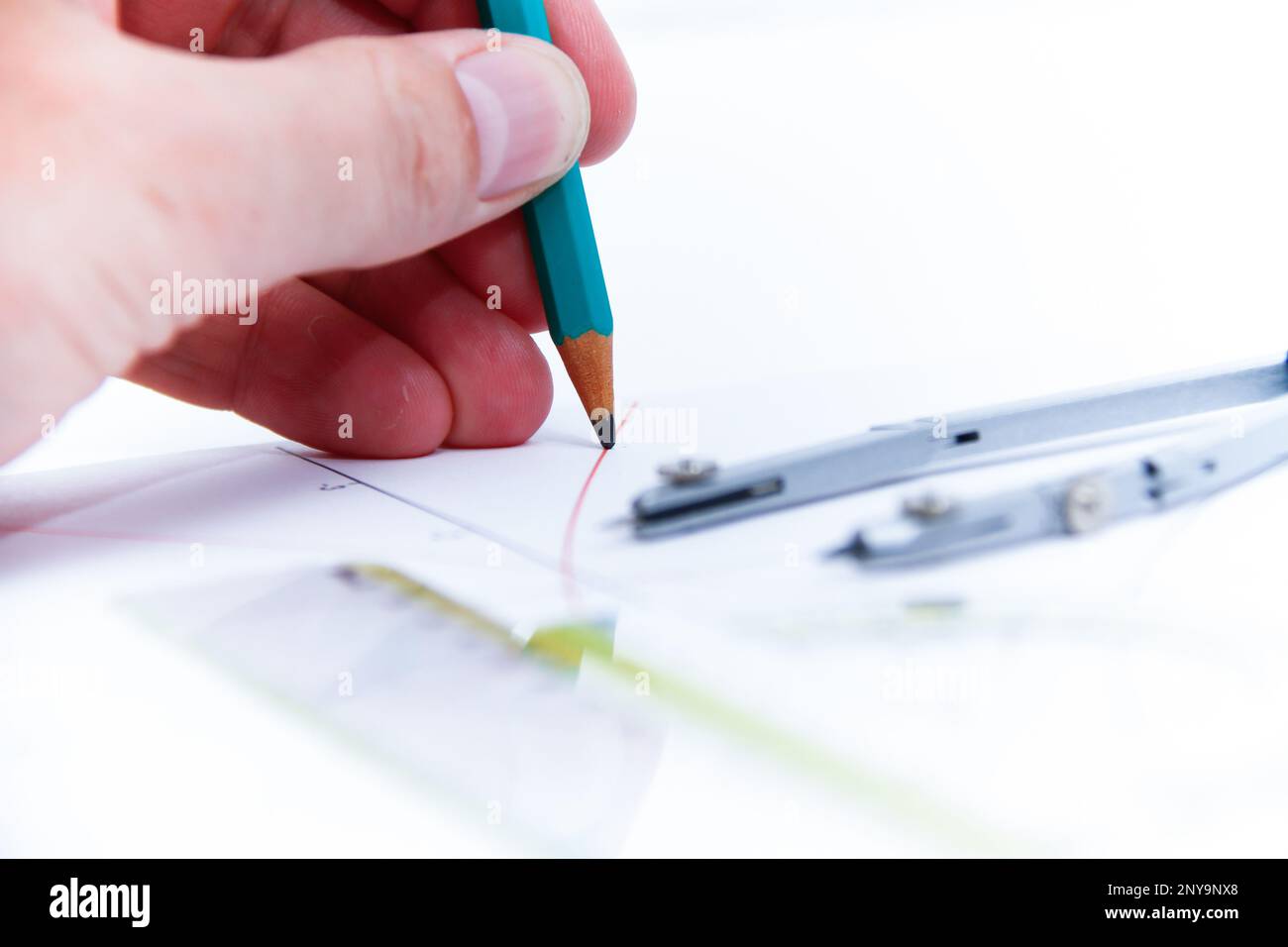 Professional architect working at his desk, measuring and estimating ...