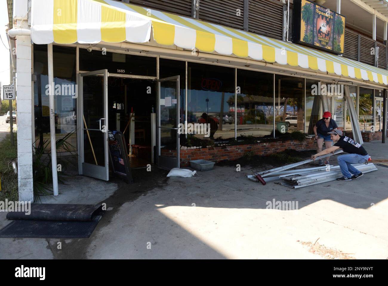 Employees begin to clean up Spanky's Beachside on Strand Avenue on ...