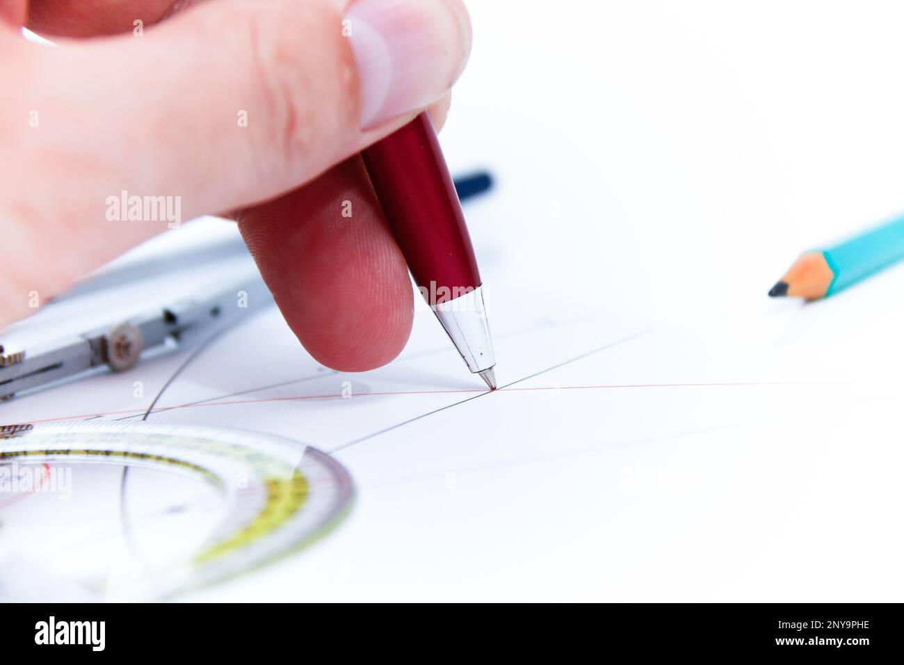 Professional architect working at his desk, measuring and estimating ...