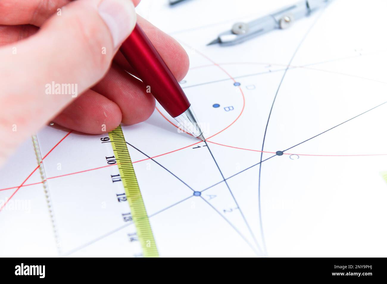 Professional architect working at his desk, measuring and estimating ...