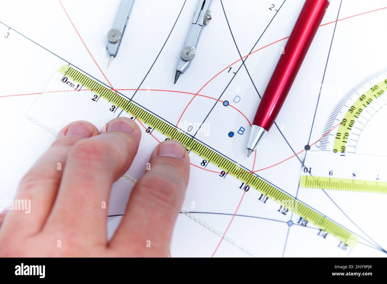 Professional architect working at his desk, measuring and estimating ...