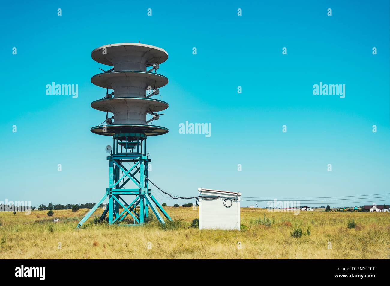 renewable energy source. Windmill and generator in the field ...