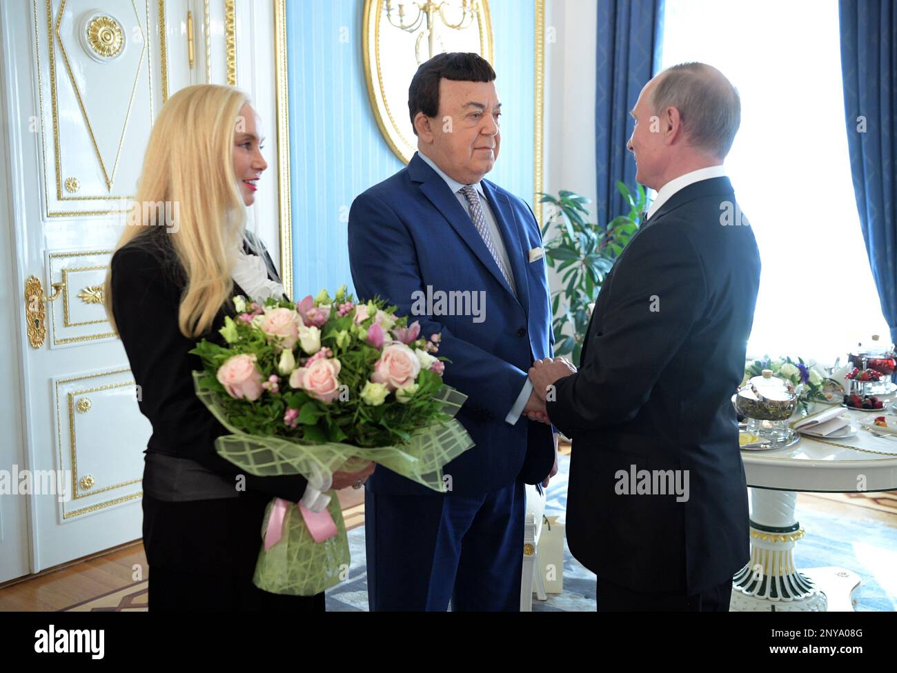 Russian President Vladimir Putin, right, congratulates popular Russian ...