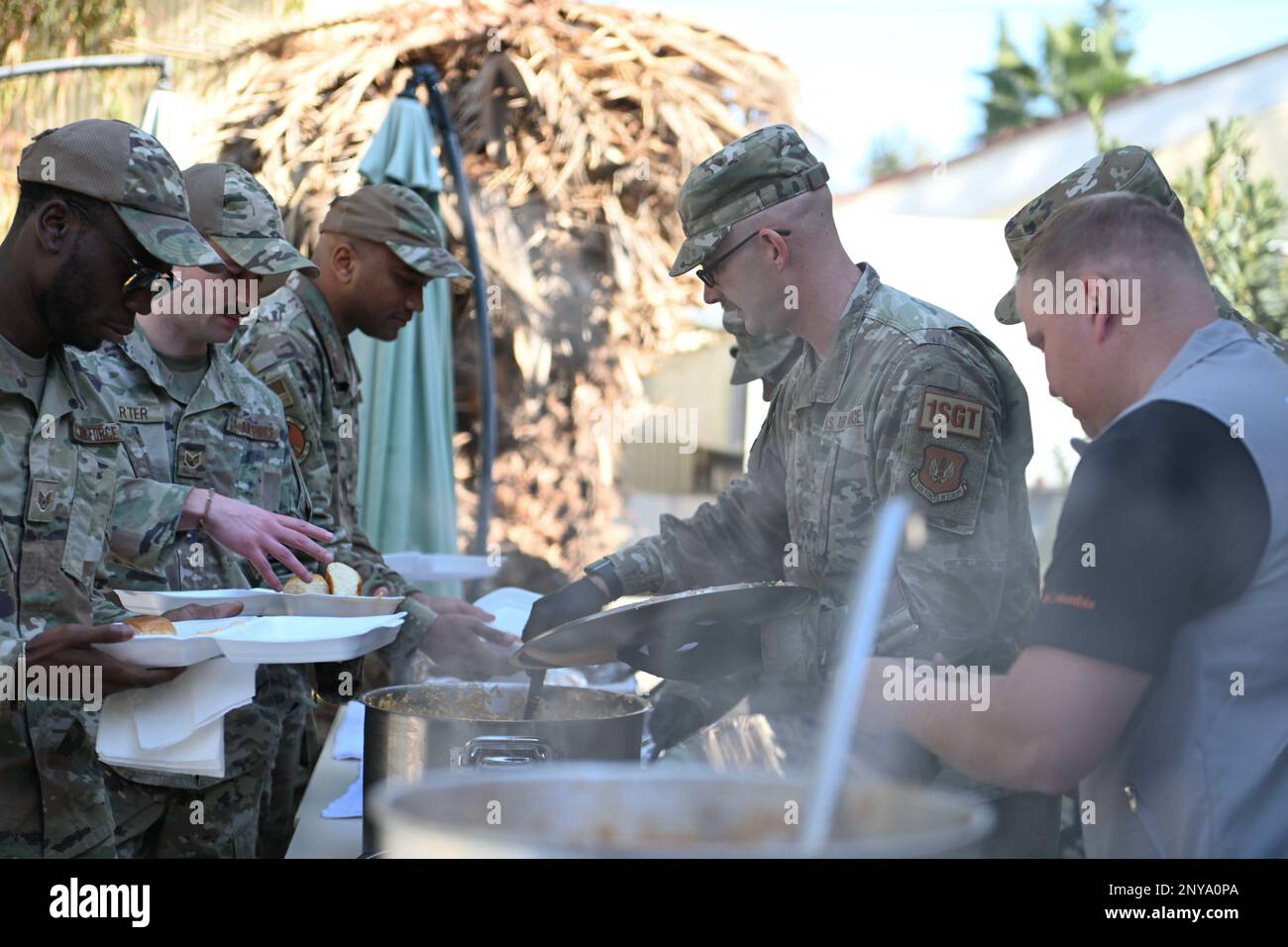 Senior leaders from various 39th Air Base Wing units serve food to ...