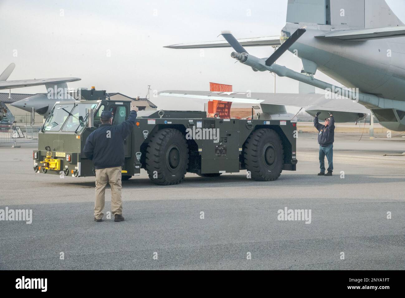 Air Mobility Command Museum staff line up a tow vehicle to correctly ...