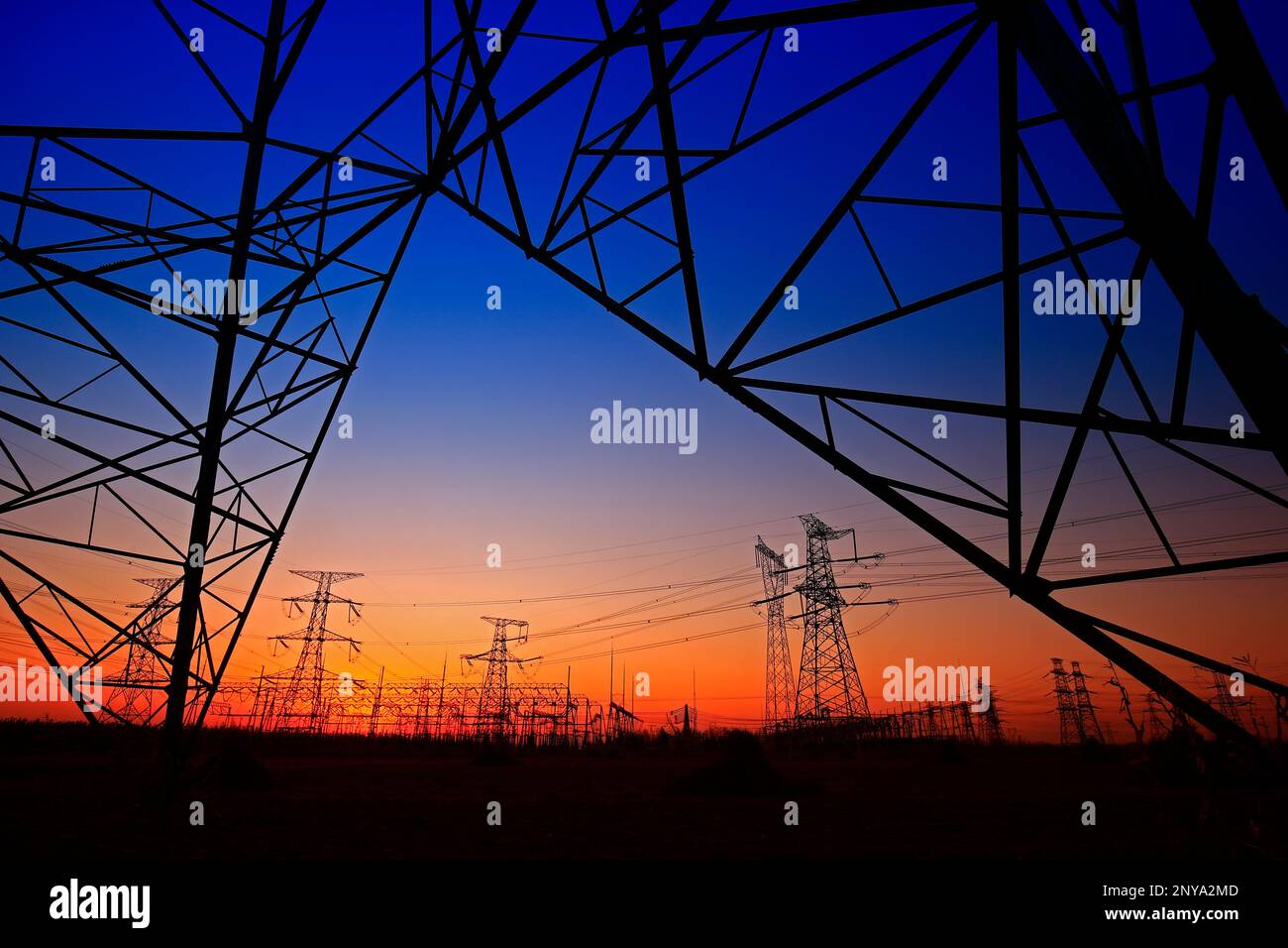 Sunset silhouette of pylon Stock Photo - Alamy