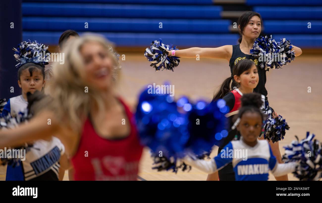Marine Corps Air Station Iwakuni children perform a cheer routine with ...