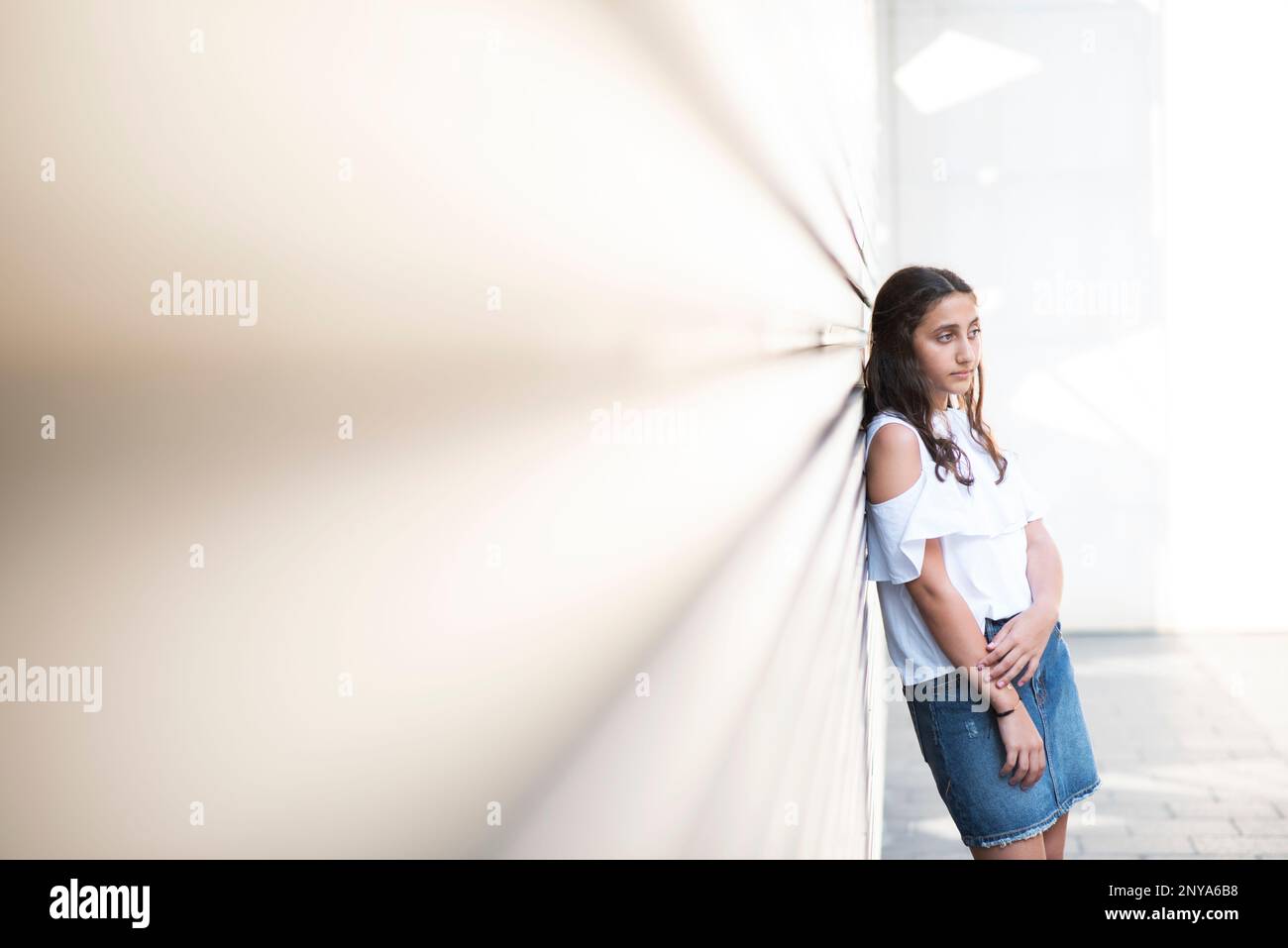 Beautiful teenage girl looking away outdoors Stock Photo - Alamy