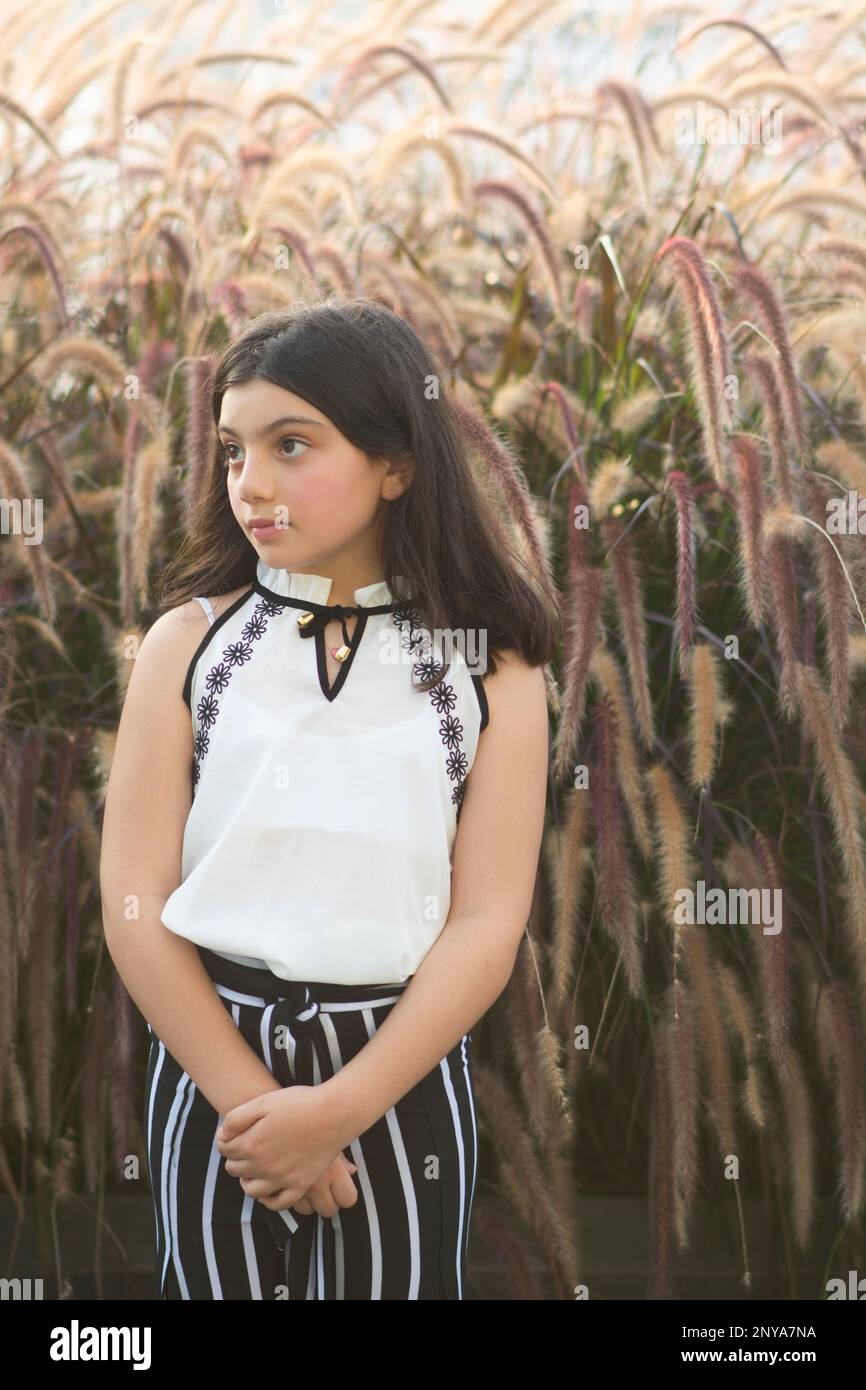 Beautiful girl looking away outdoors Stock Photo - Alamy
