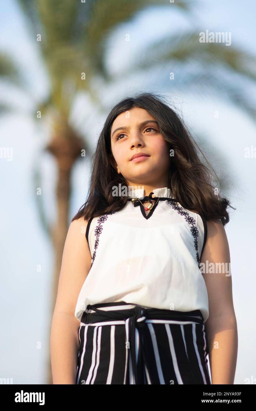 Serious girl looking away outdoors Stock Photo - Alamy