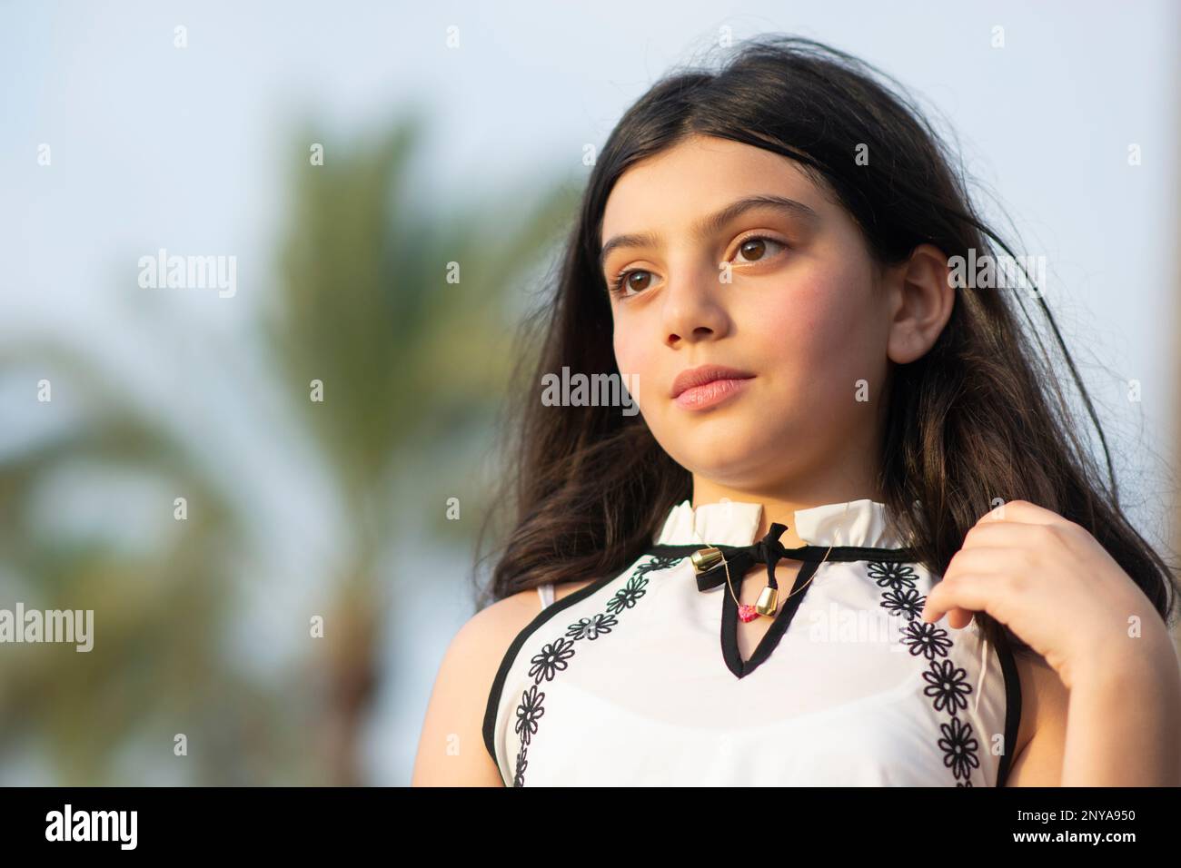 Beautiful girl looking away outdoors Stock Photo - Alamy