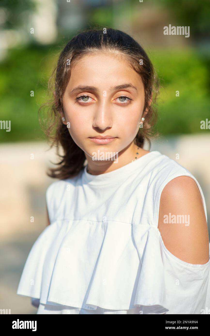 Serious teenage girl looking at camera otudoors Stock Photo - Alamy