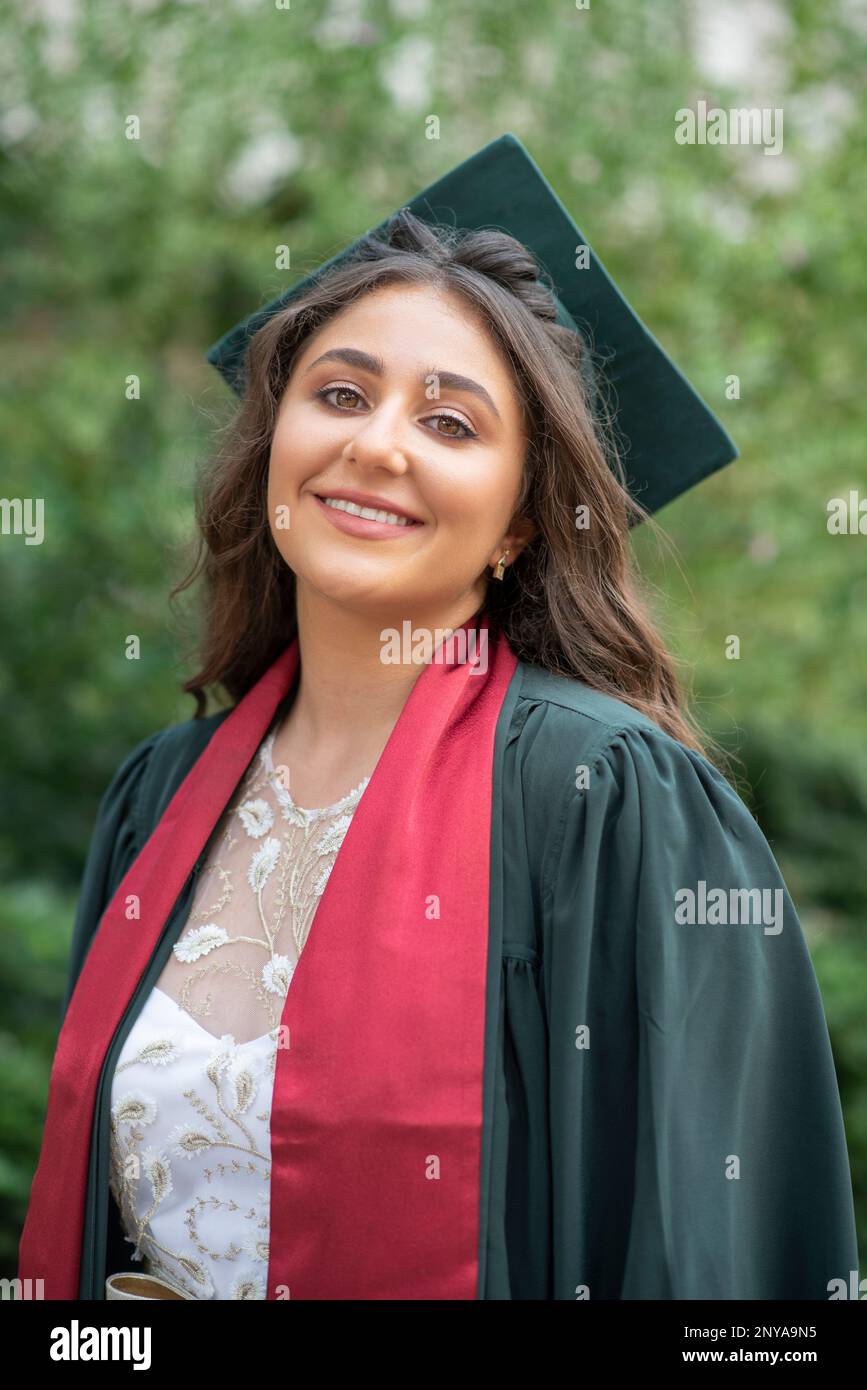 Beautiful female gradute outdoors Stock Photo - Alamy