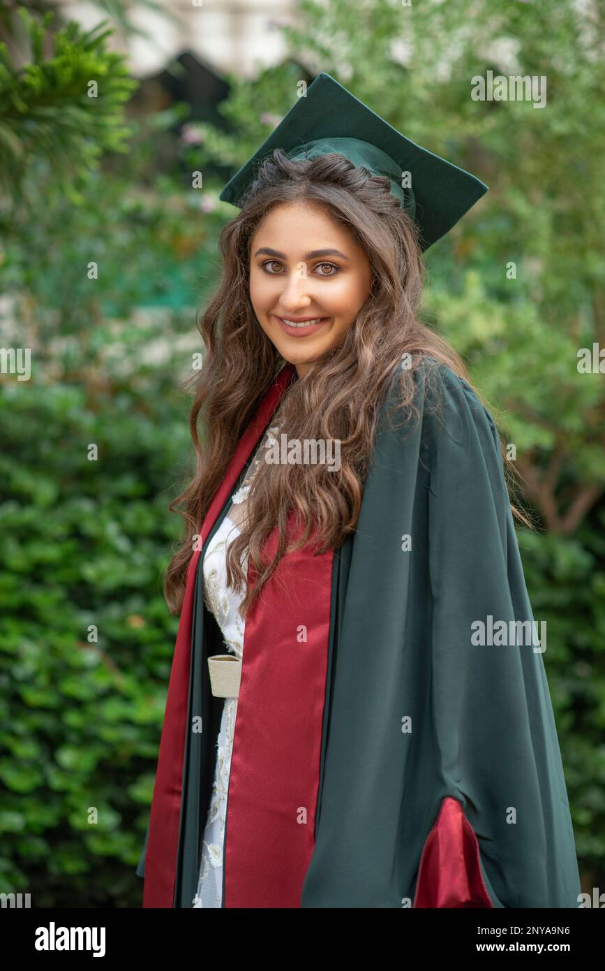 Beautiful female gradute outdoors Stock Photo - Alamy