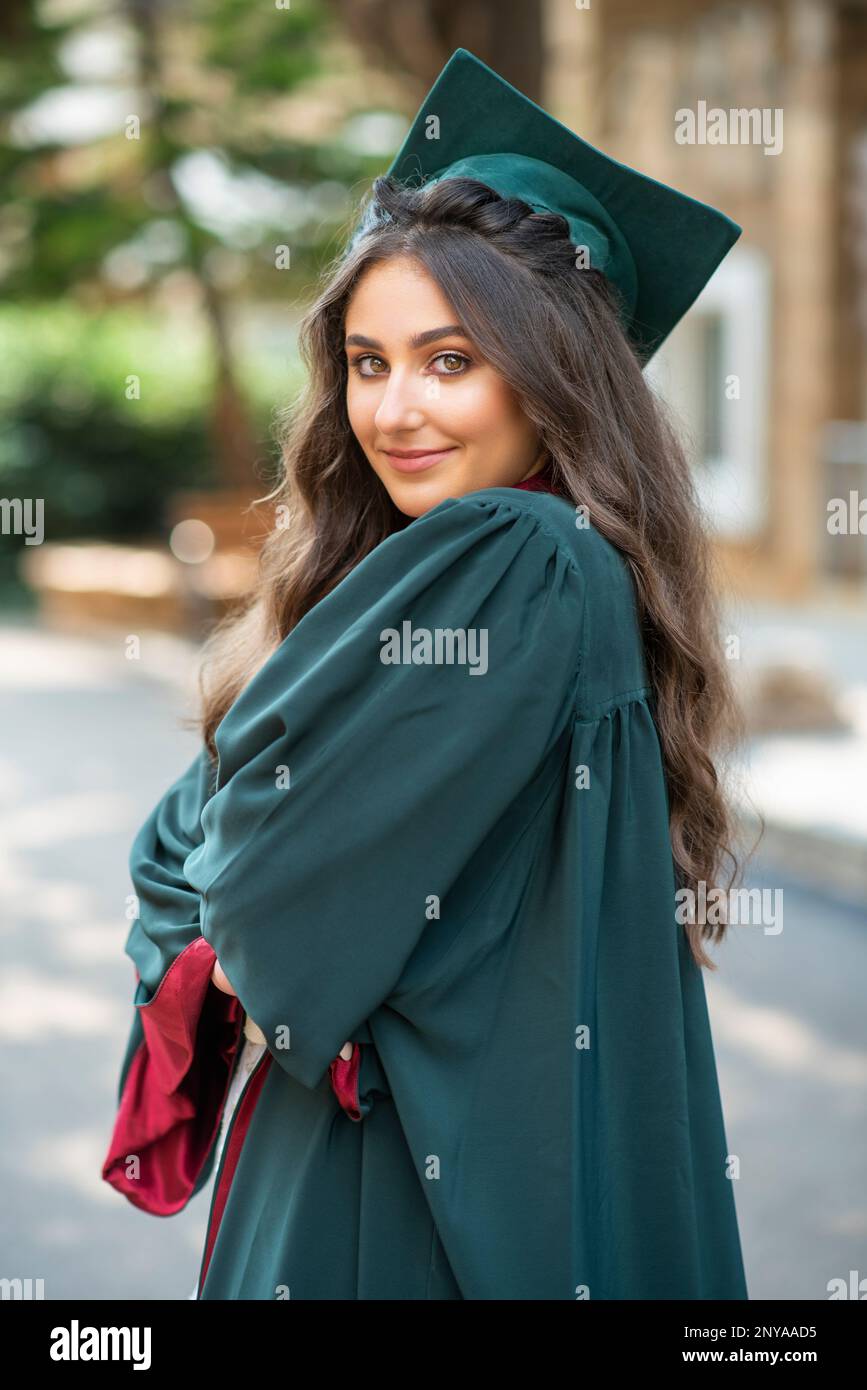 Beautiful female gradute outdoors Stock Photo - Alamy