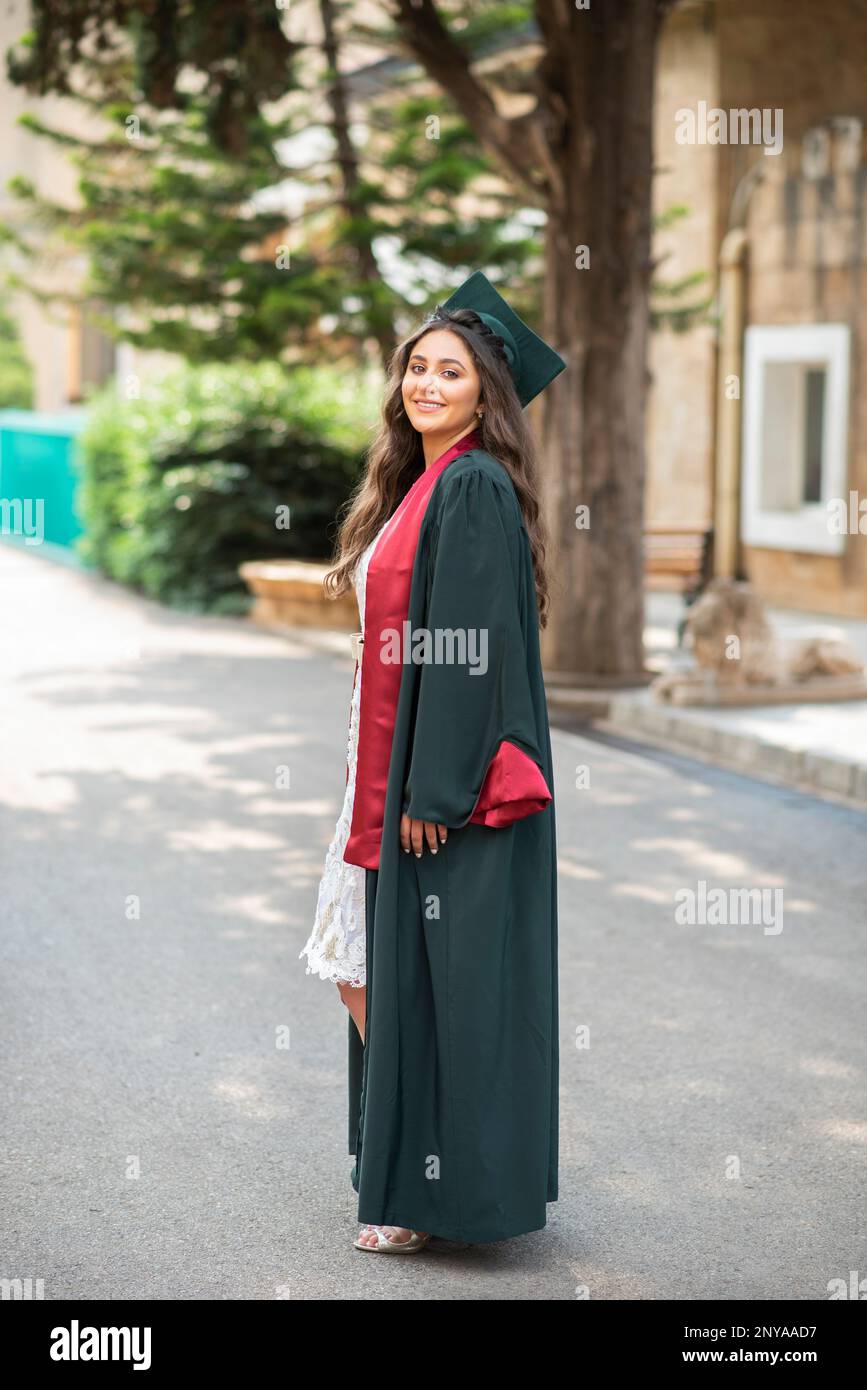 Beautiful female gradute outdoors Stock Photo - Alamy
