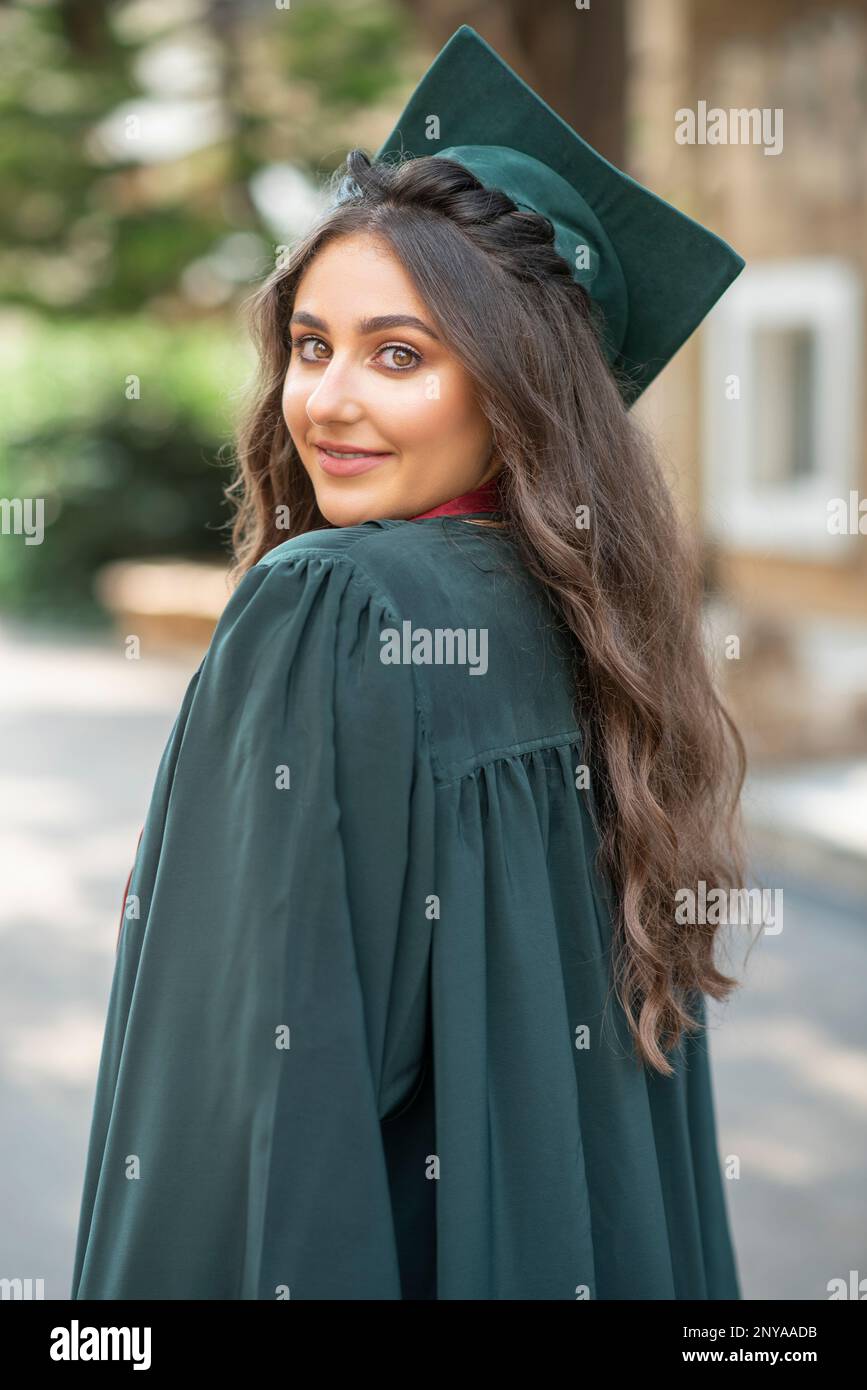 Beautiful female gradute outdoors Stock Photo - Alamy
