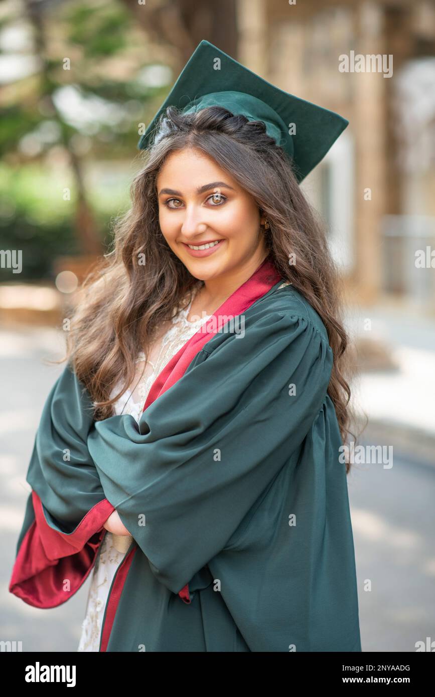 Beautiful female gradute outdoors Stock Photo - Alamy