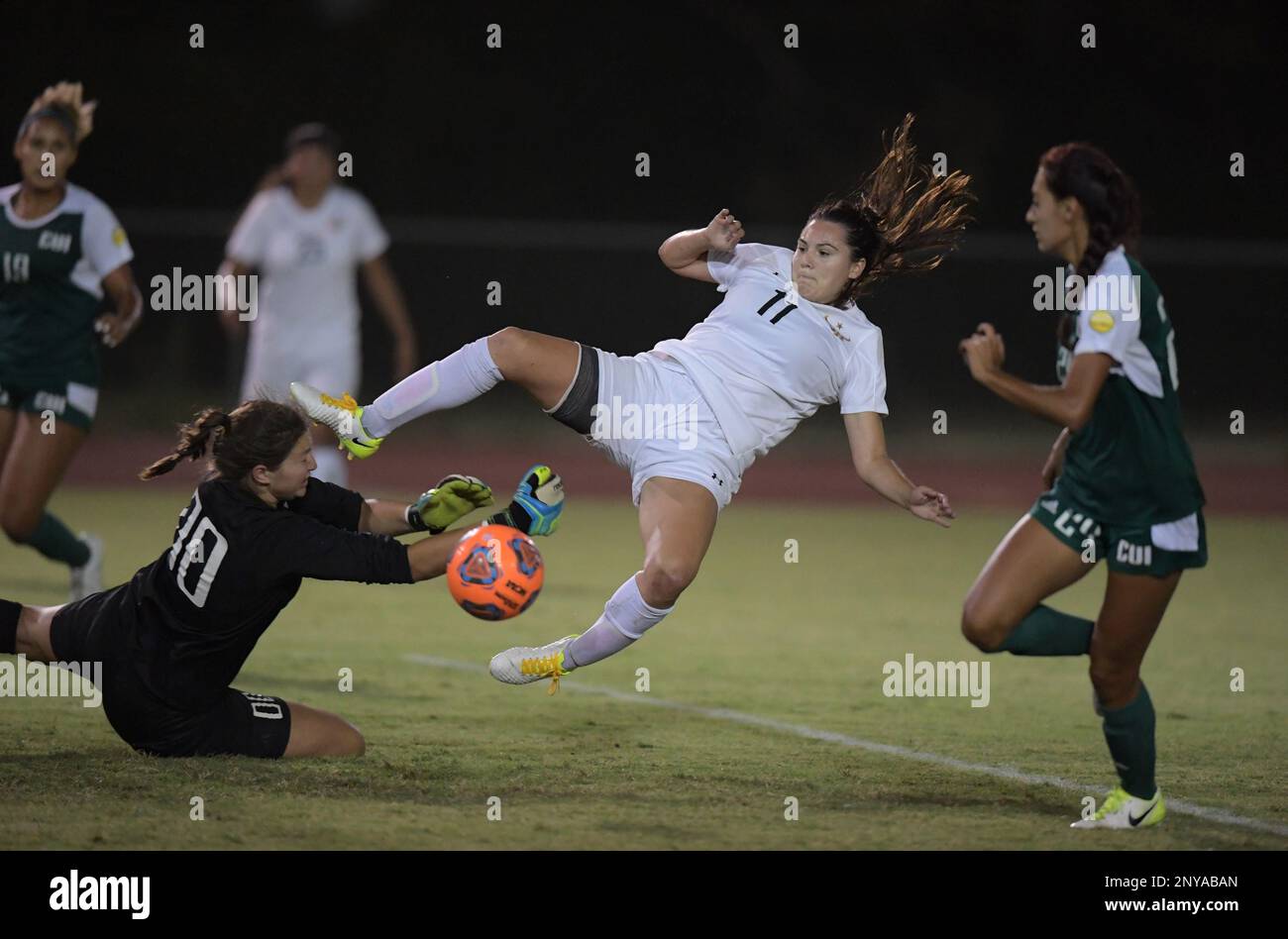 Cal State Dominguez Hills midfielder Dana Dibble (11) takes a shot as ...
