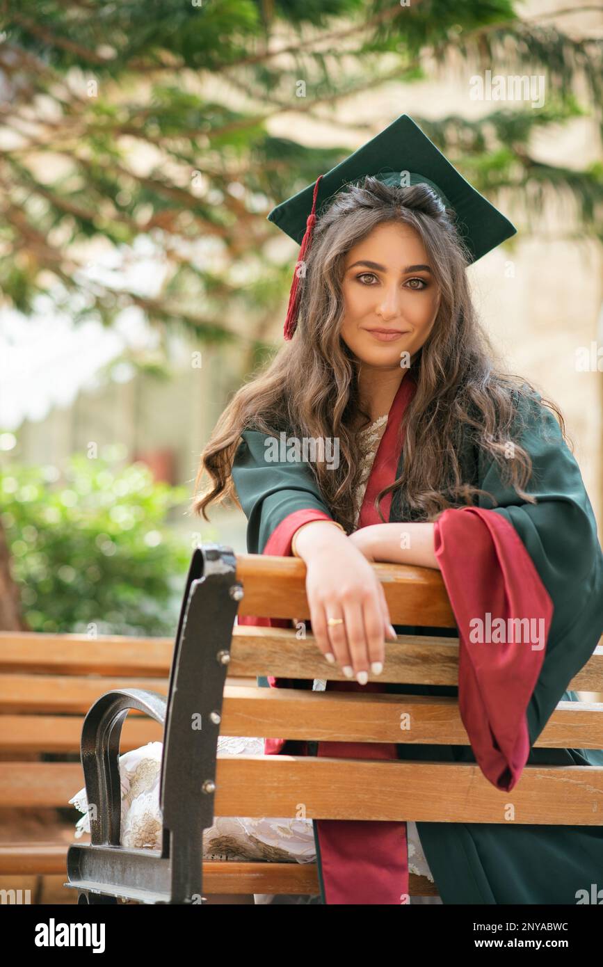Beautiful female gradute outdoors Stock Photo - Alamy