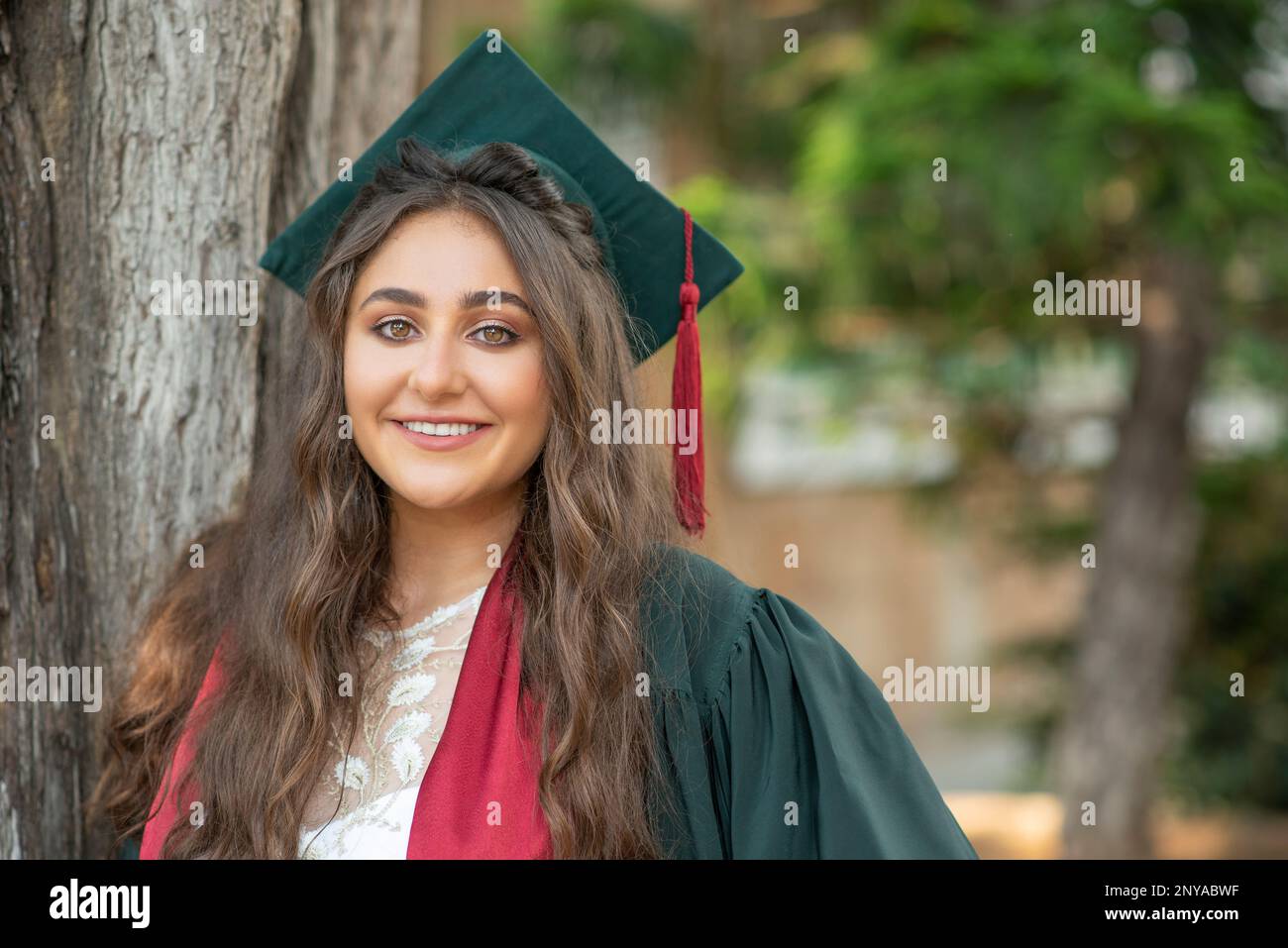 Beautiful female gradute outdoors Stock Photo - Alamy