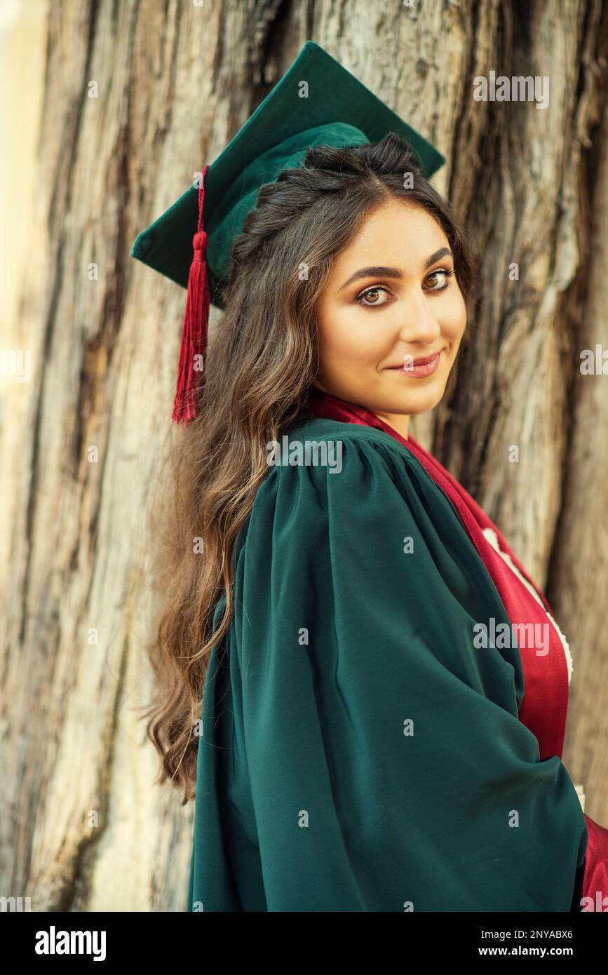 Beautiful female gradute outdoors Stock Photo - Alamy
