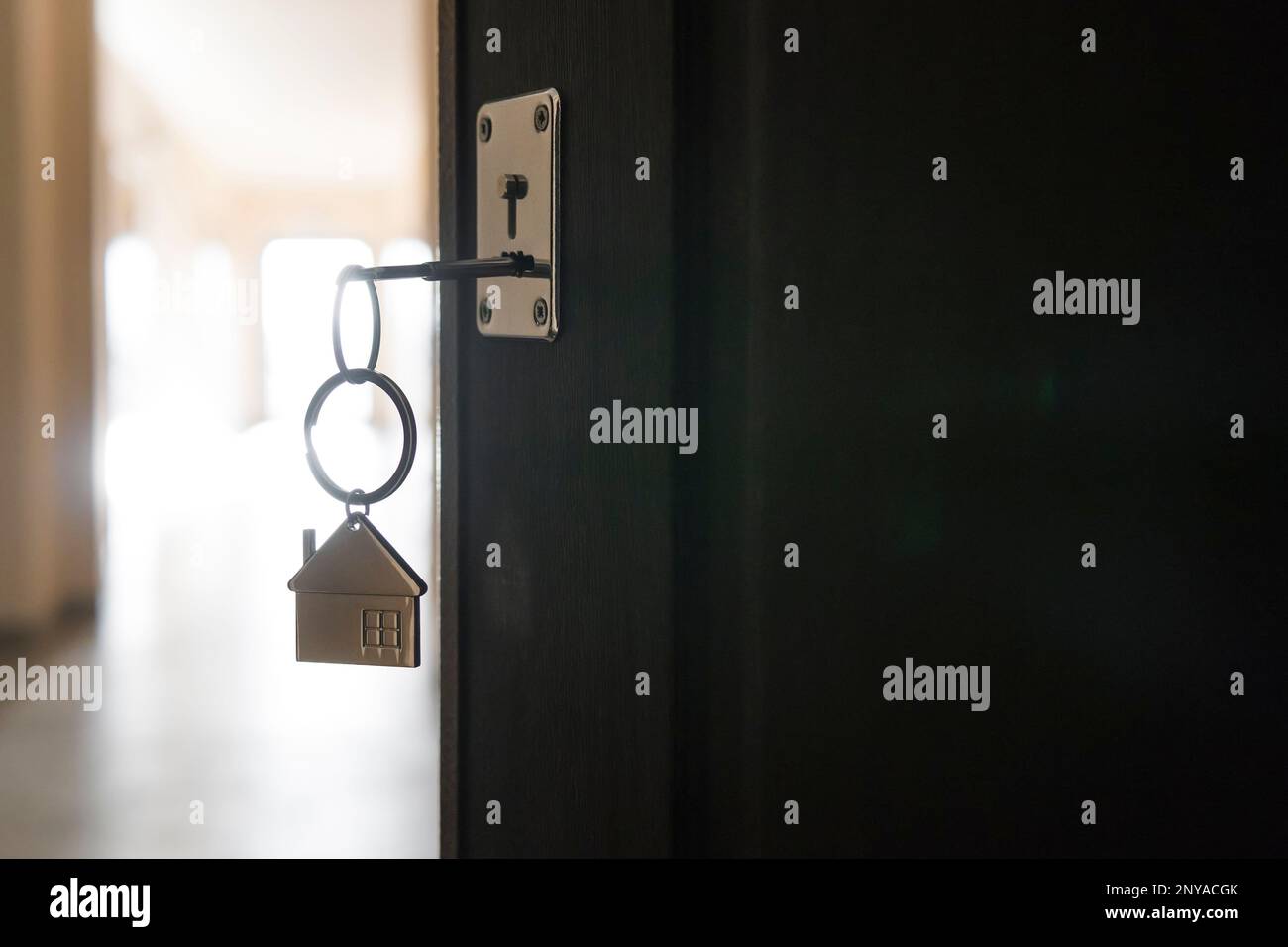 process of opening the front door to the apartment. House model and key ...