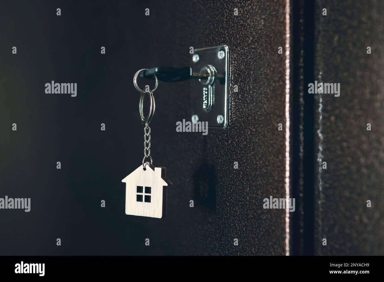 process of opening the front door to the apartment. House model and key ...