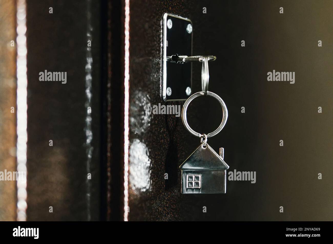 process of opening the front door to the apartment. House model and key ...