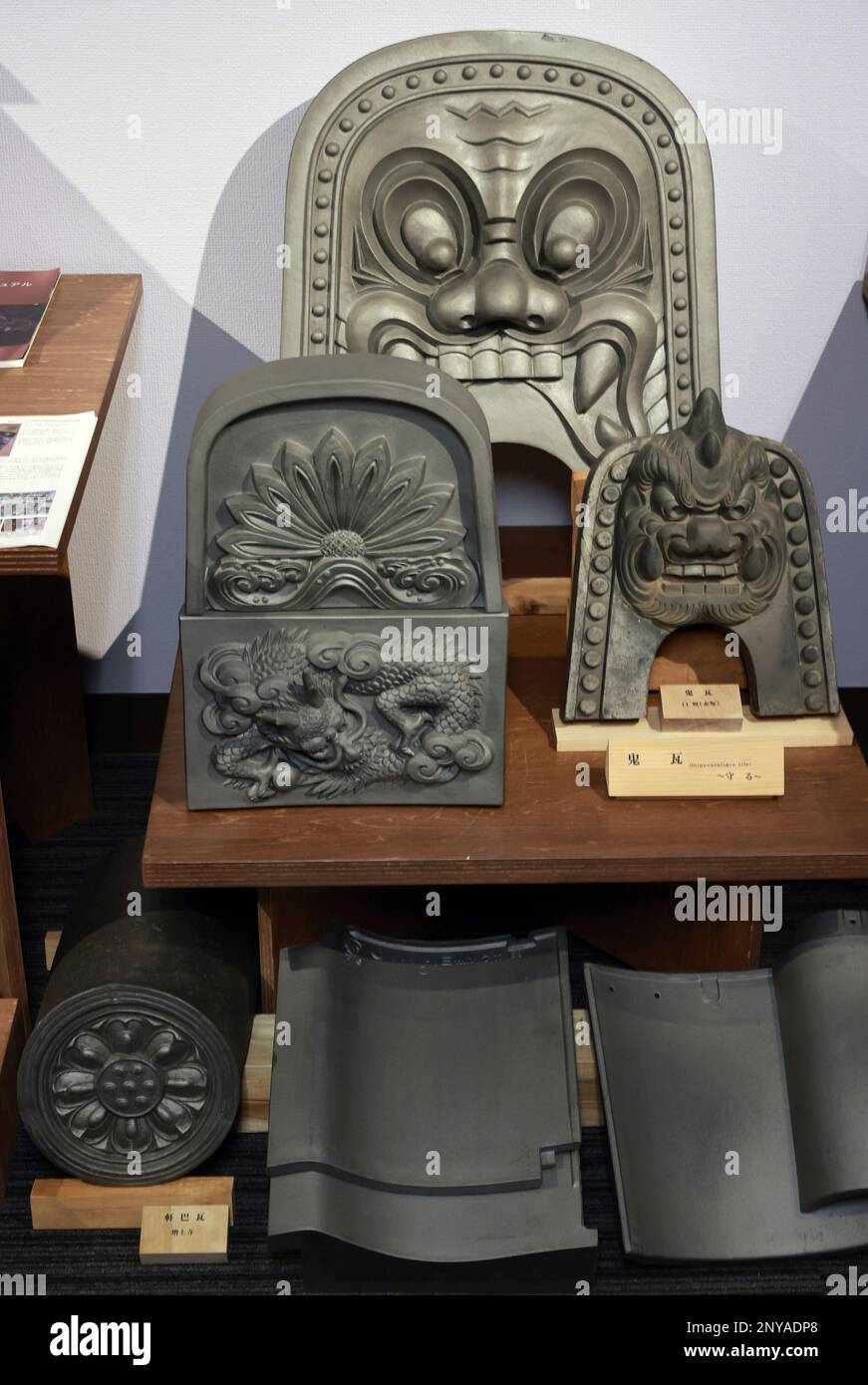 Onigawara (Japanese gargoyle roof tiles) are displayed at Kigumi ...