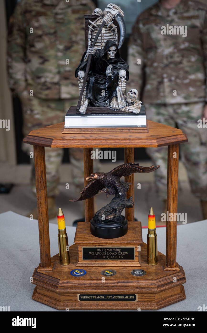 The 4th Fighter Wing Weapons Load Crew of the Quarter trophy sits on a ...