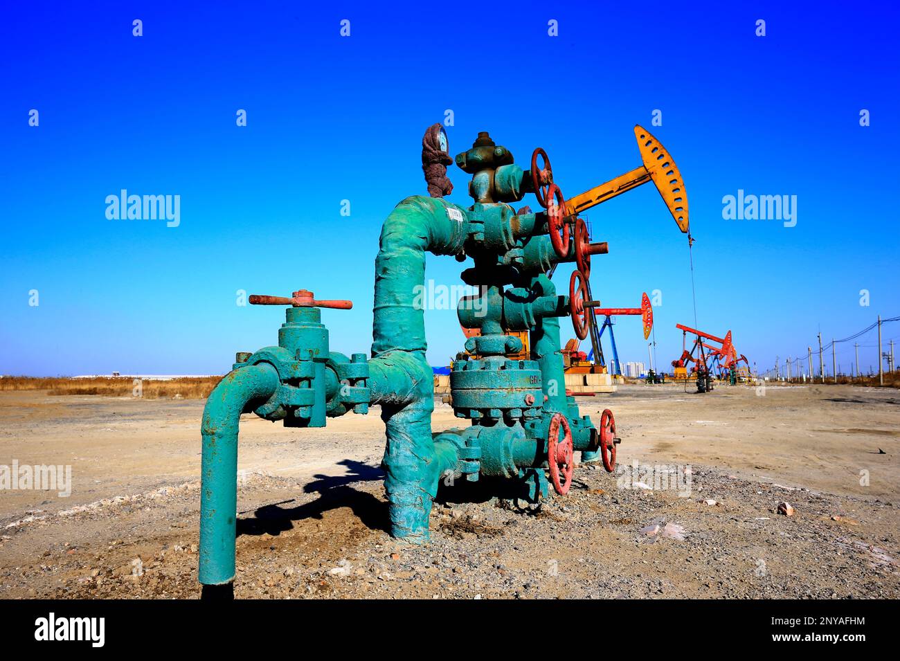 Oil pipes and valves Stock Photo - Alamy