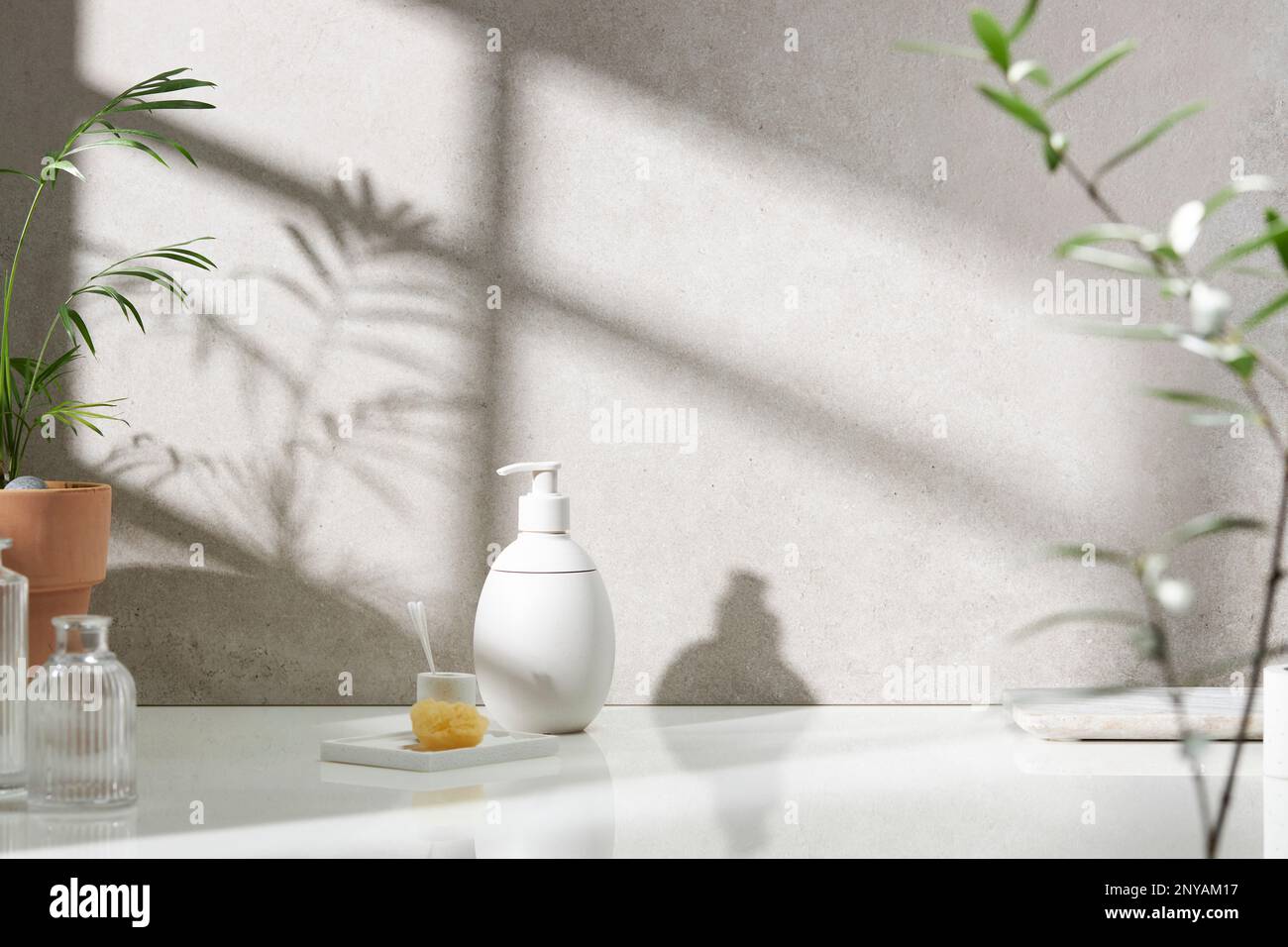 Various objects on a white tile background with warm sunlight shining ...