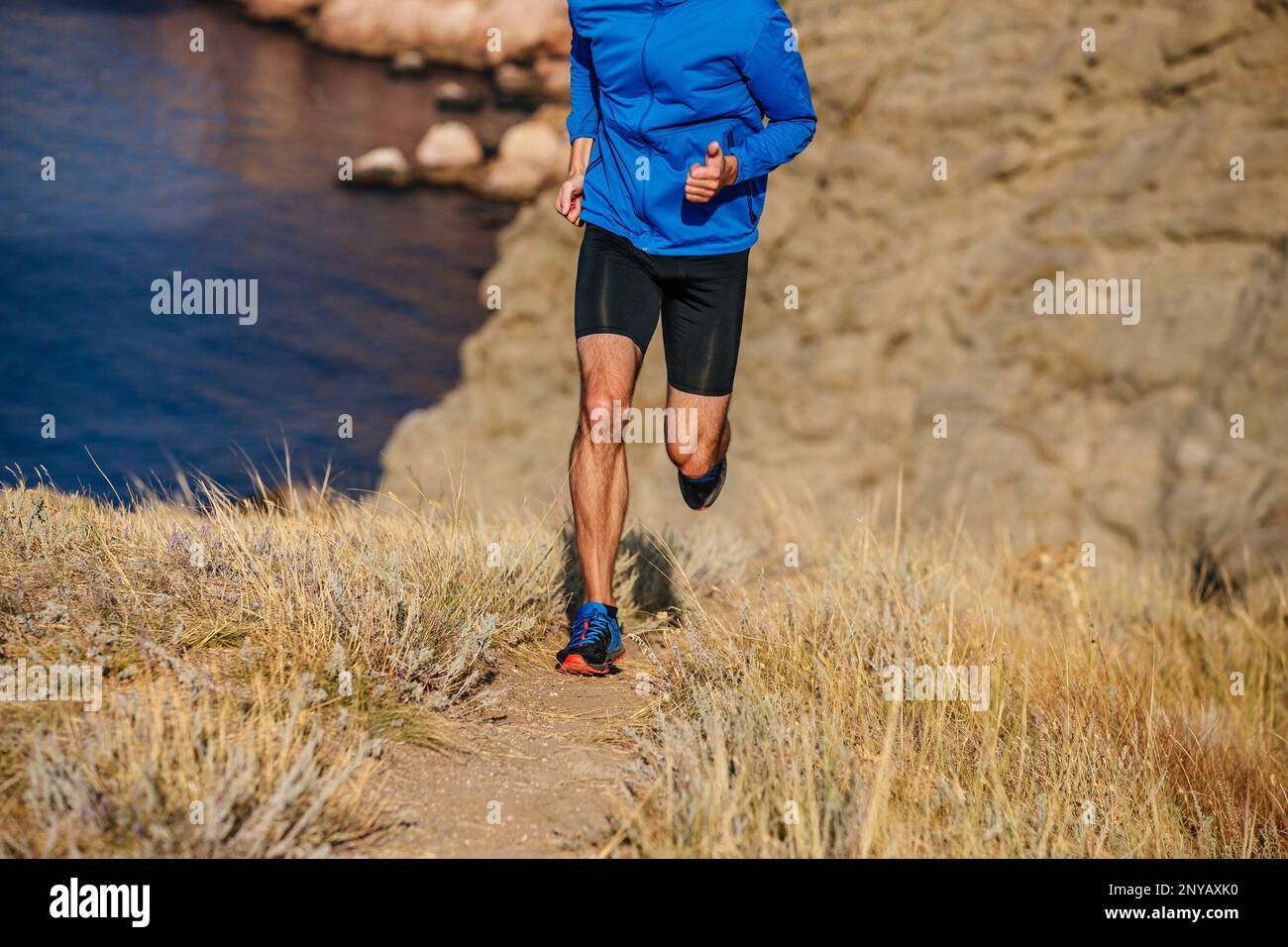 Muscular male runner running hi-res stock photography and images - Alamy