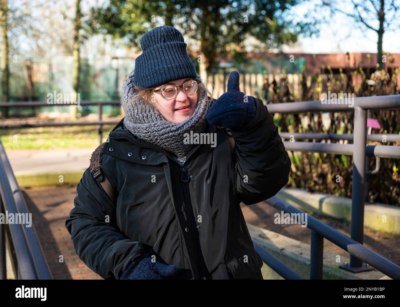 40 year old happy white woman with the Down Syndrome, wearing a hat and ...