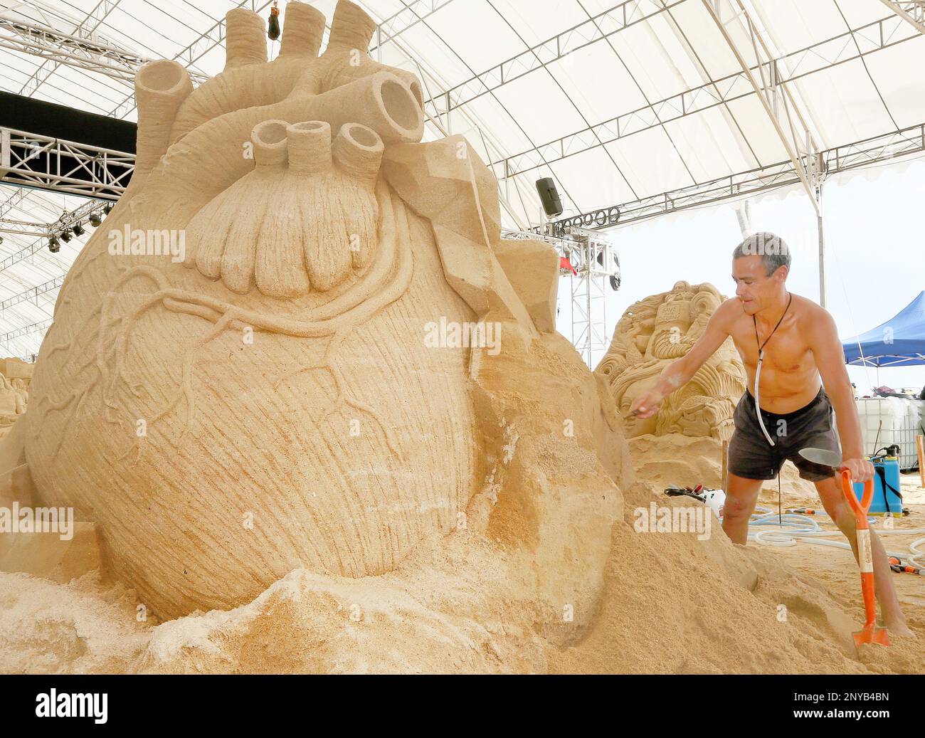 Winner Pedro Mira from Portugal working on his piece, Broken Heart. He ...