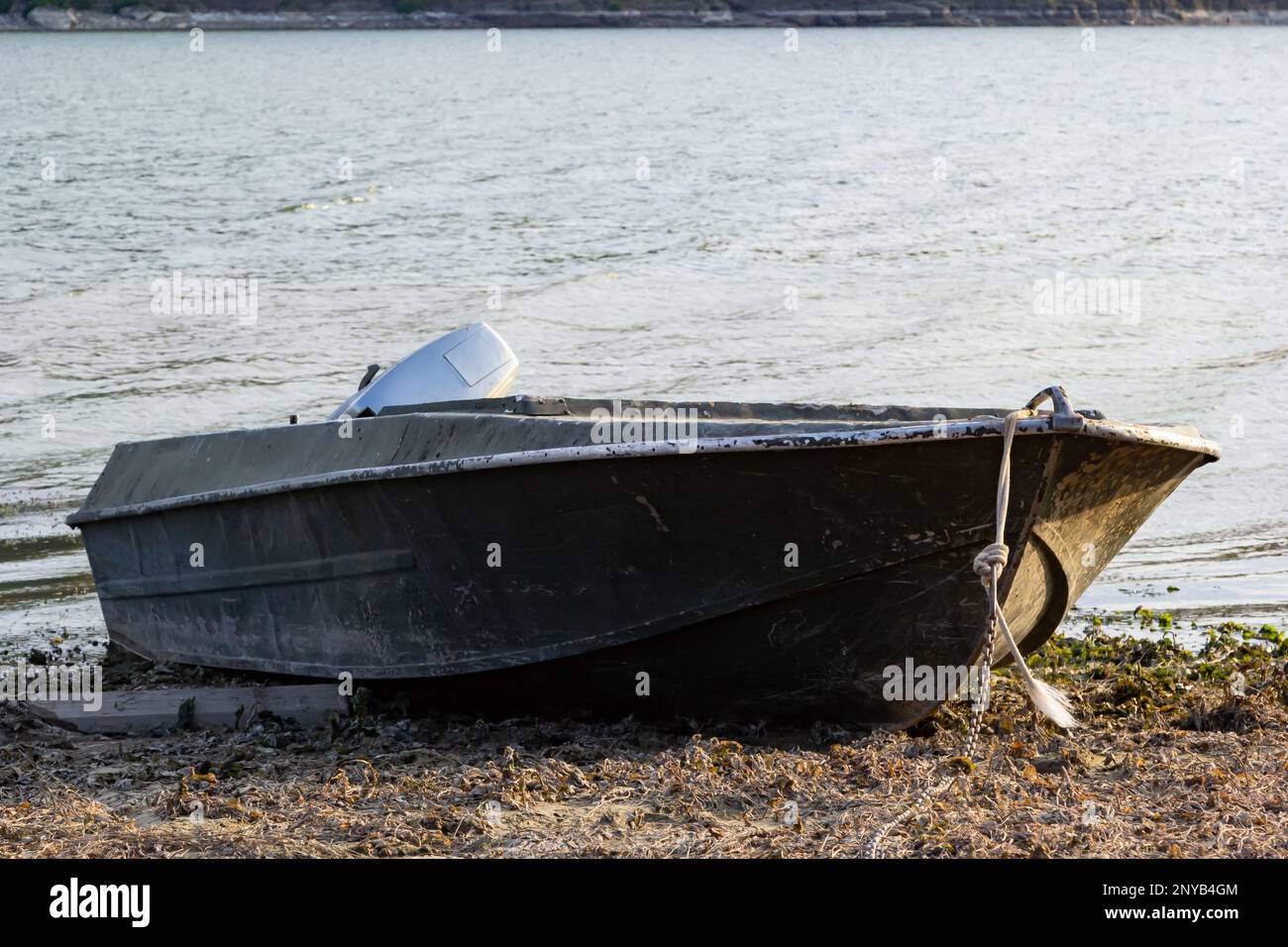 the boat stands on the bank of the river. Means of transportation on ...