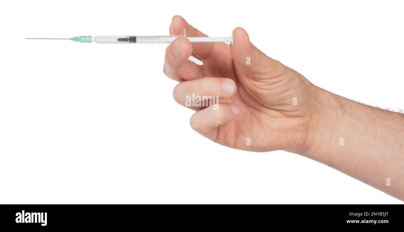 New syringe in adult hand on white background, medical and health care ...
