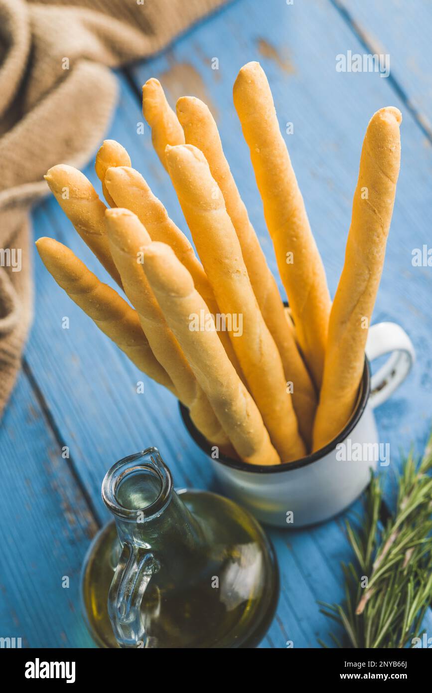 Italian grissini bread sticks on the blue table Stock Photo - Alamy
