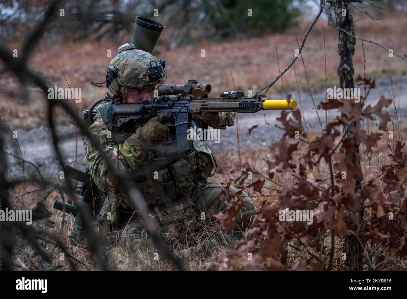 An East-Coast-based U.S. Naval Special Warfare Operator (SEAL) fires at ...