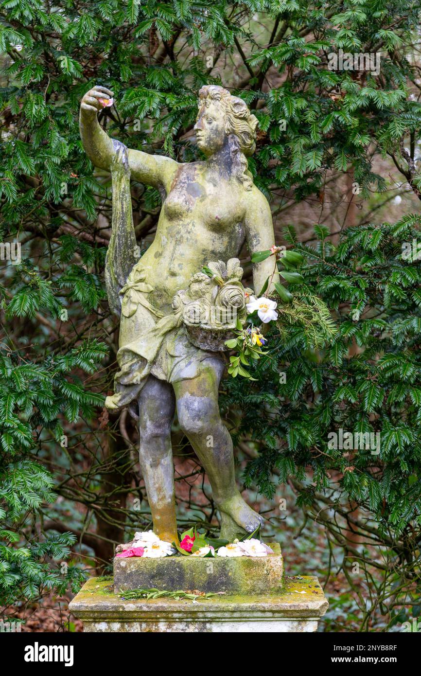 'Flora' classical sculpture female goddess figure artwork in garden, Dartington Hall estate ...